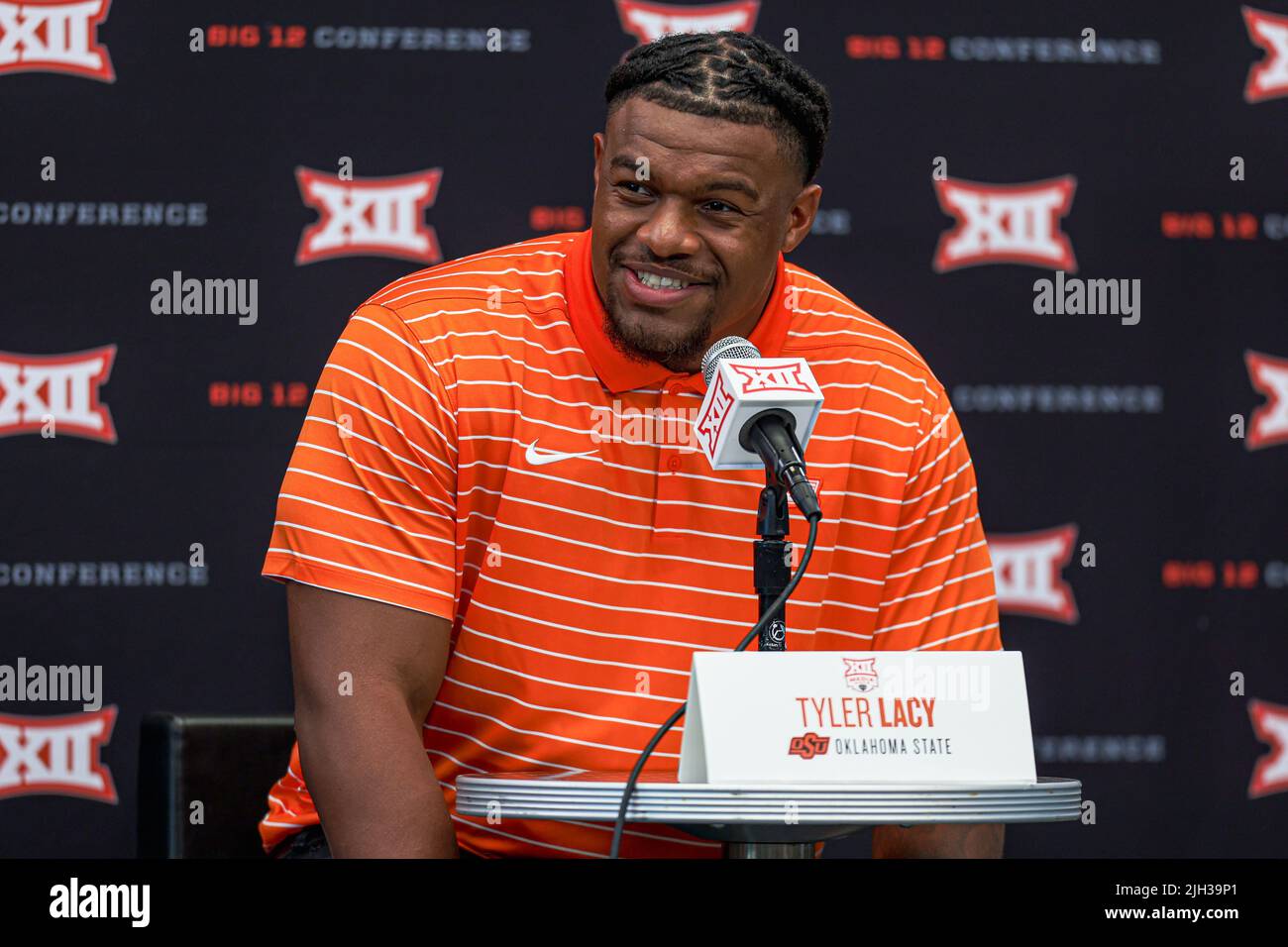 Oklahoma State Cowboys defensive lineman Tyler Lacy speaks during Big ...