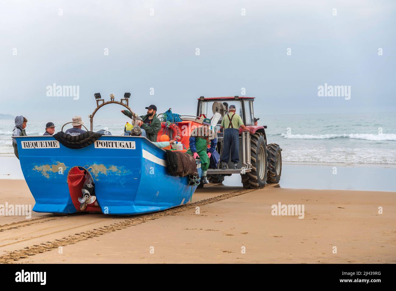 Fishermans working in Fonte da Telha beach in Almada Portugal Stock ...