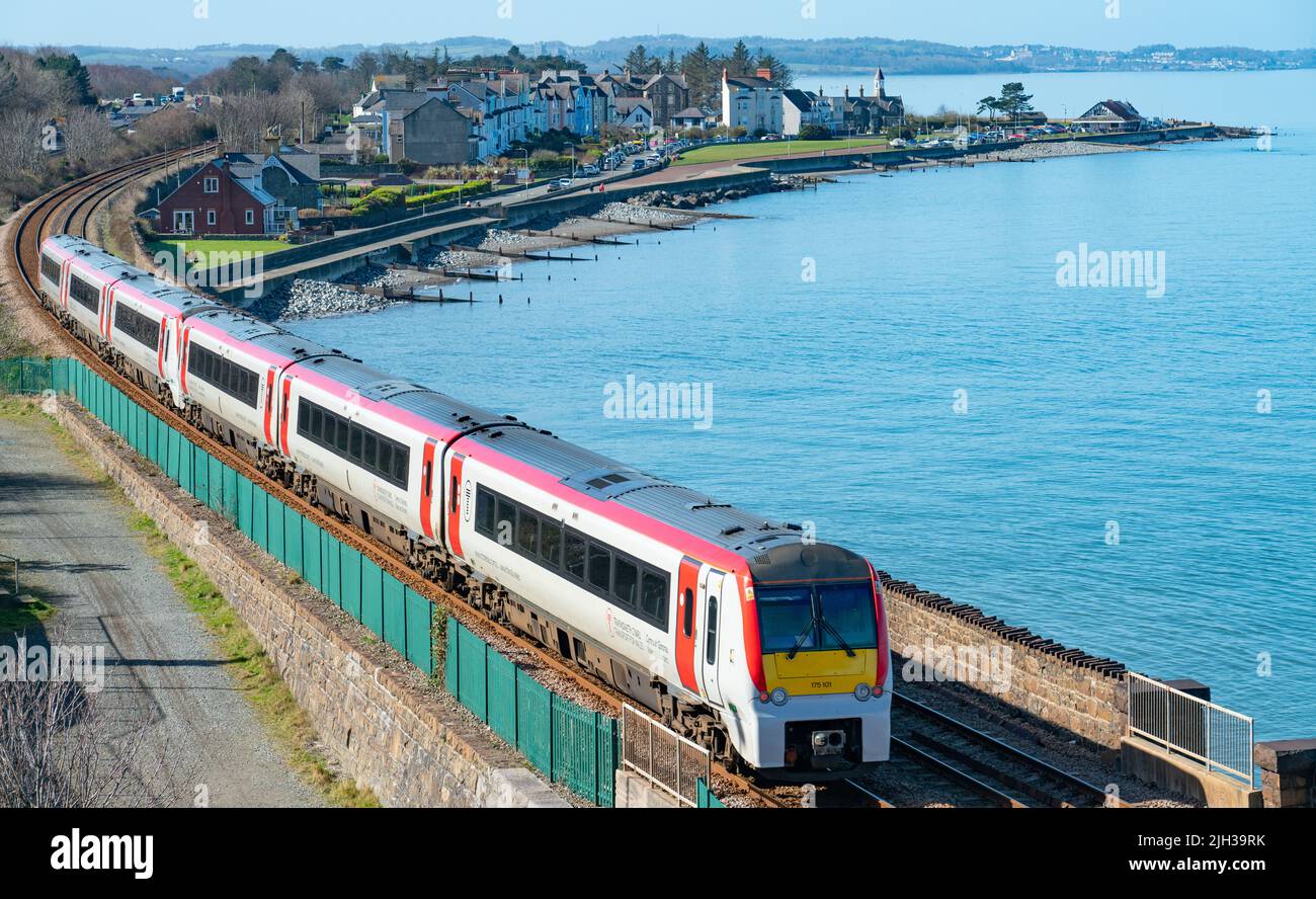 Llanfairfechan promenade with the Chester to Holyhead train. Image ...