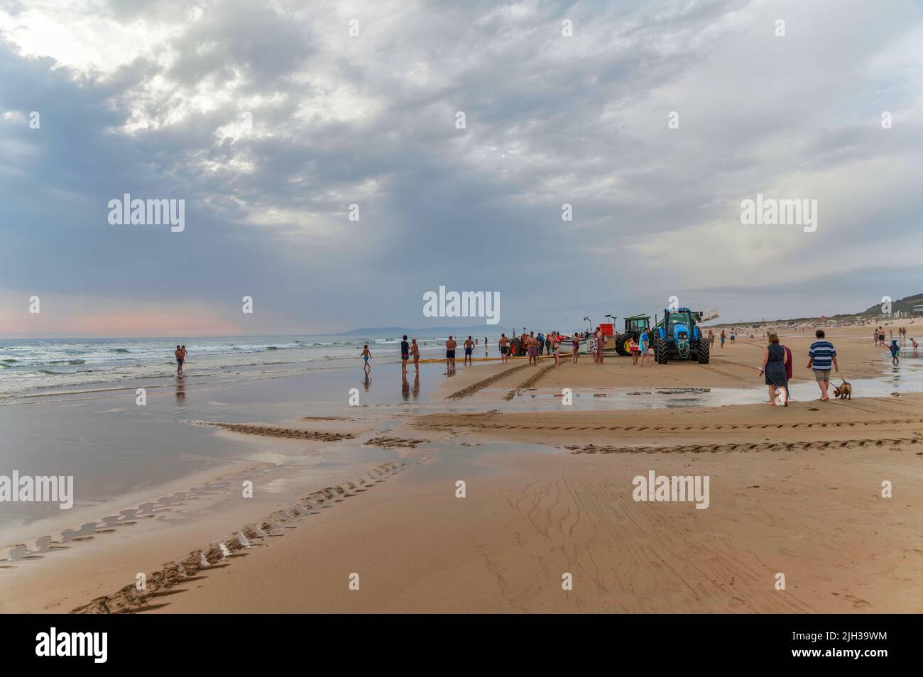 Fishermans working in Fonte da Telha beach in Almada Portugal Stock ...