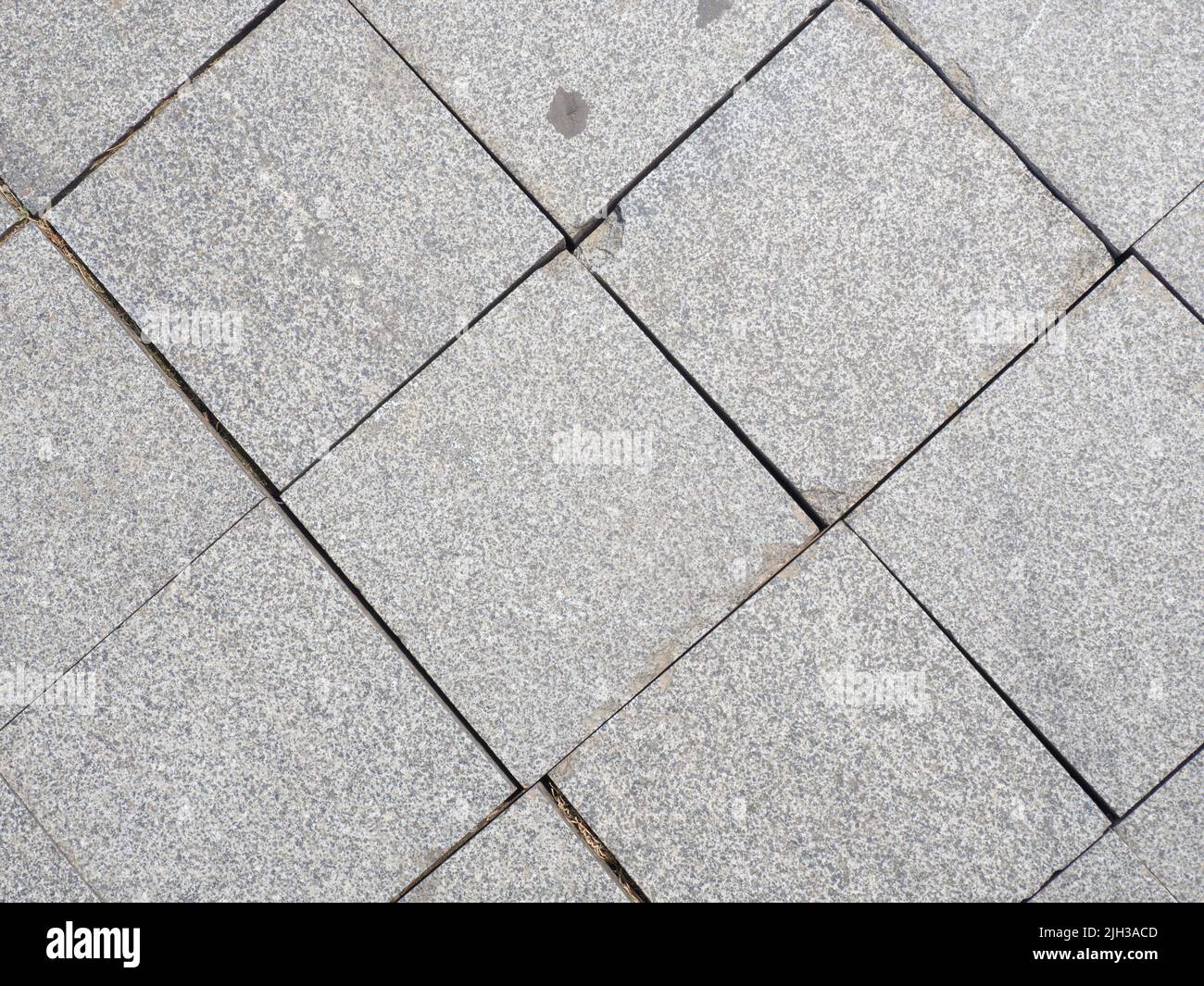 Drawing tiles on the pavement. Stone street surface. Masonry. Tile ...