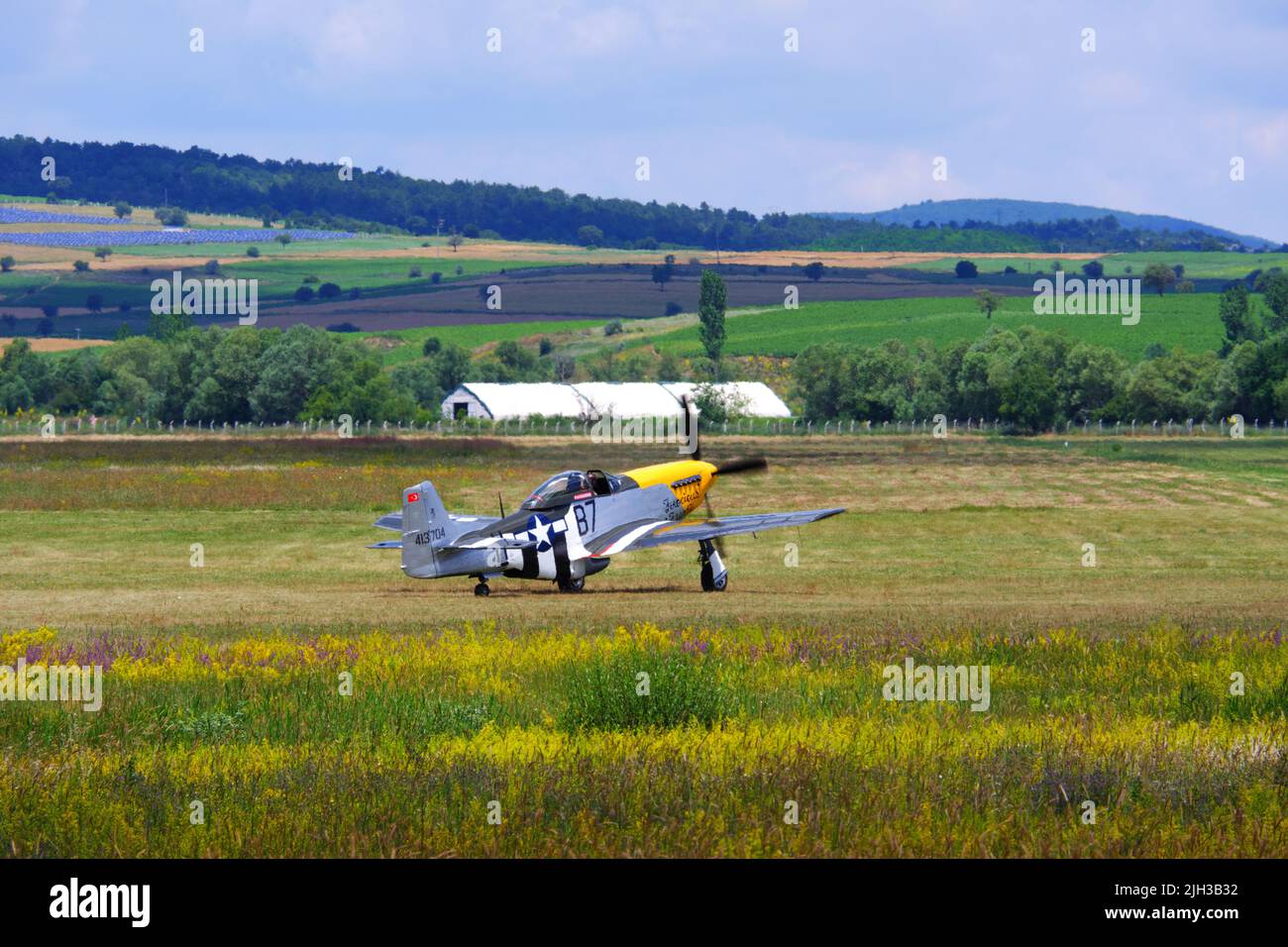 Small propeller airplane taxi on grass for taking off Stock Photo - Alamy