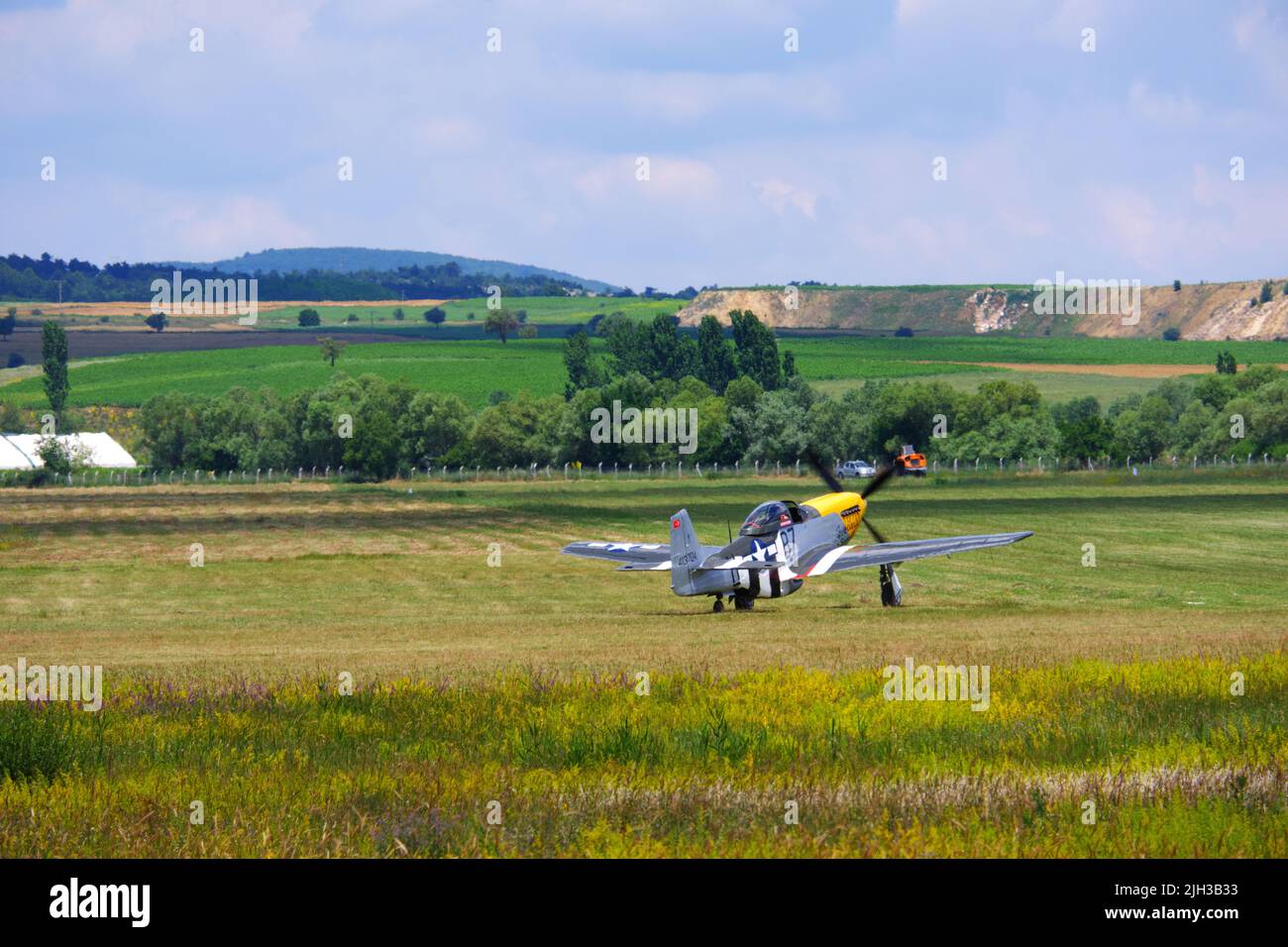 Small propeller airplane taxi on grass for taking off Stock Photo - Alamy