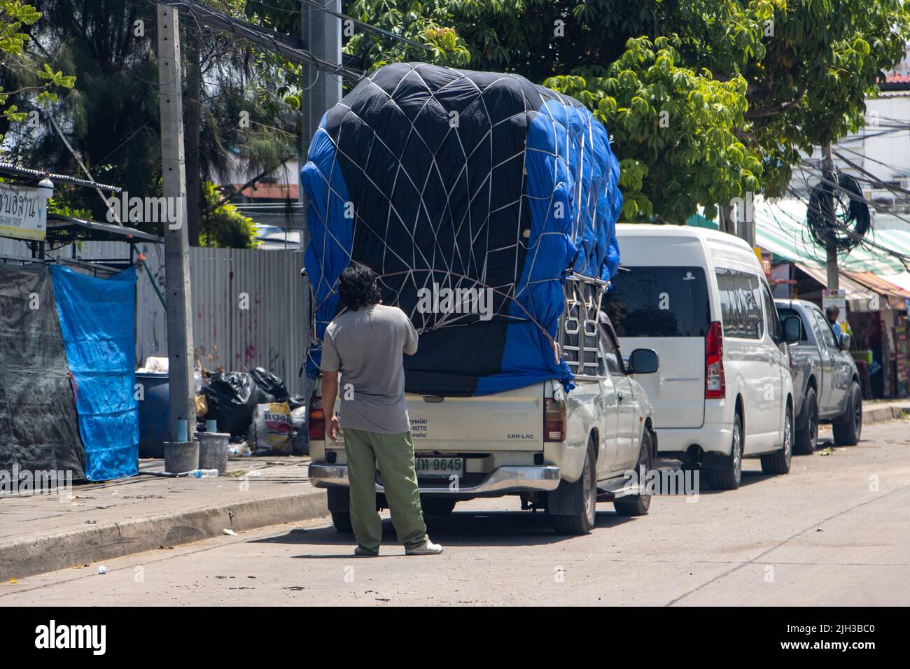SAMUT PRAKAN, THAILAND, JUNE 11 2022, A fully loaded pick up is parked ...