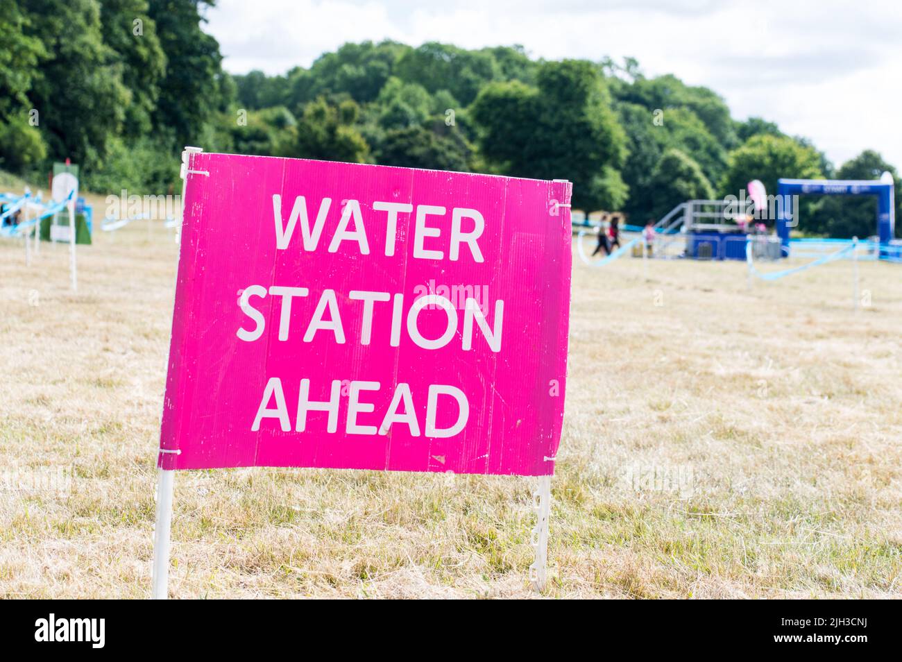 Water station ahead marker for race course Stock Photo - Alamy