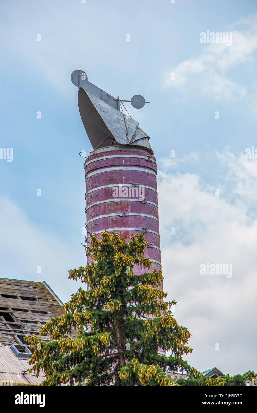 Original chimneys of an old brewery against the blue sky. The old ...