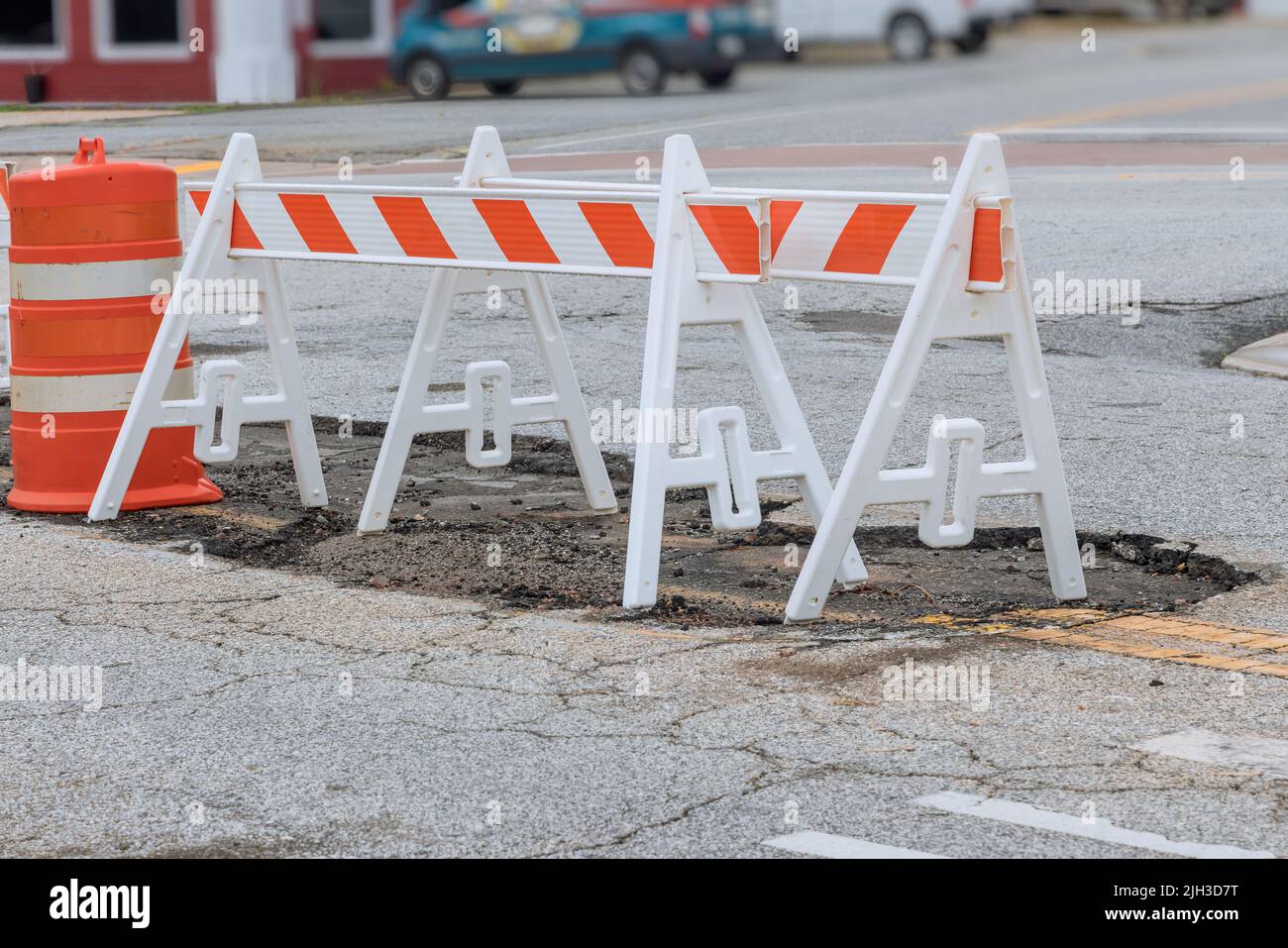 Repair of damaged asphalt or bad road potholes with a carriageway that ...