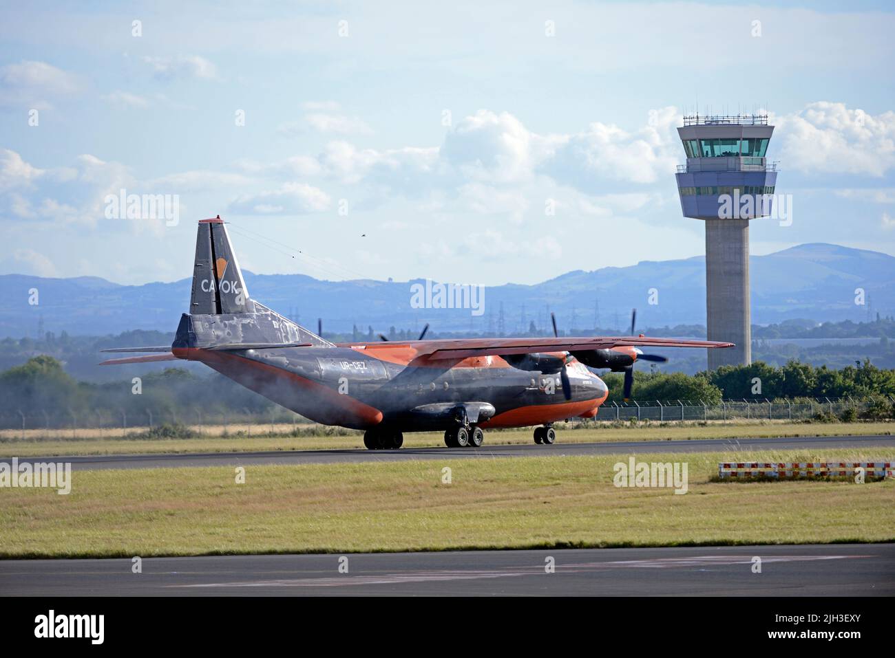 CAVOK AIR's ANTONOV AN-12, UR-CEZ, departing runway 27 at Liverpool's ...
