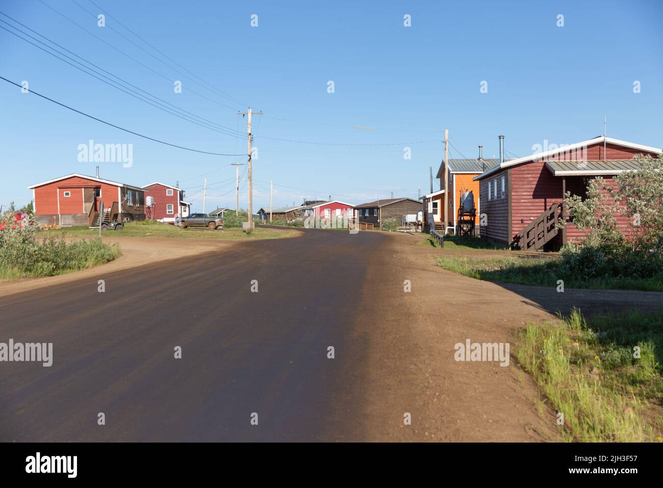 Housing along dirt road in the summer, in the northern Indigenous ...