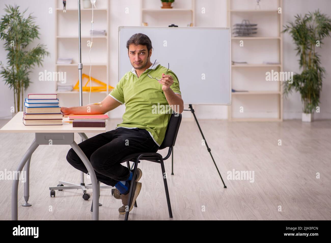Young sick teacher student in blood transfusion concept Stock Photo - Alamy