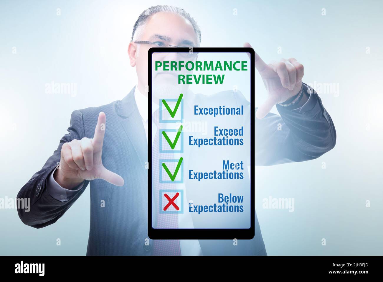 Annual performance review concept with the businessman Stock Photo - Alamy