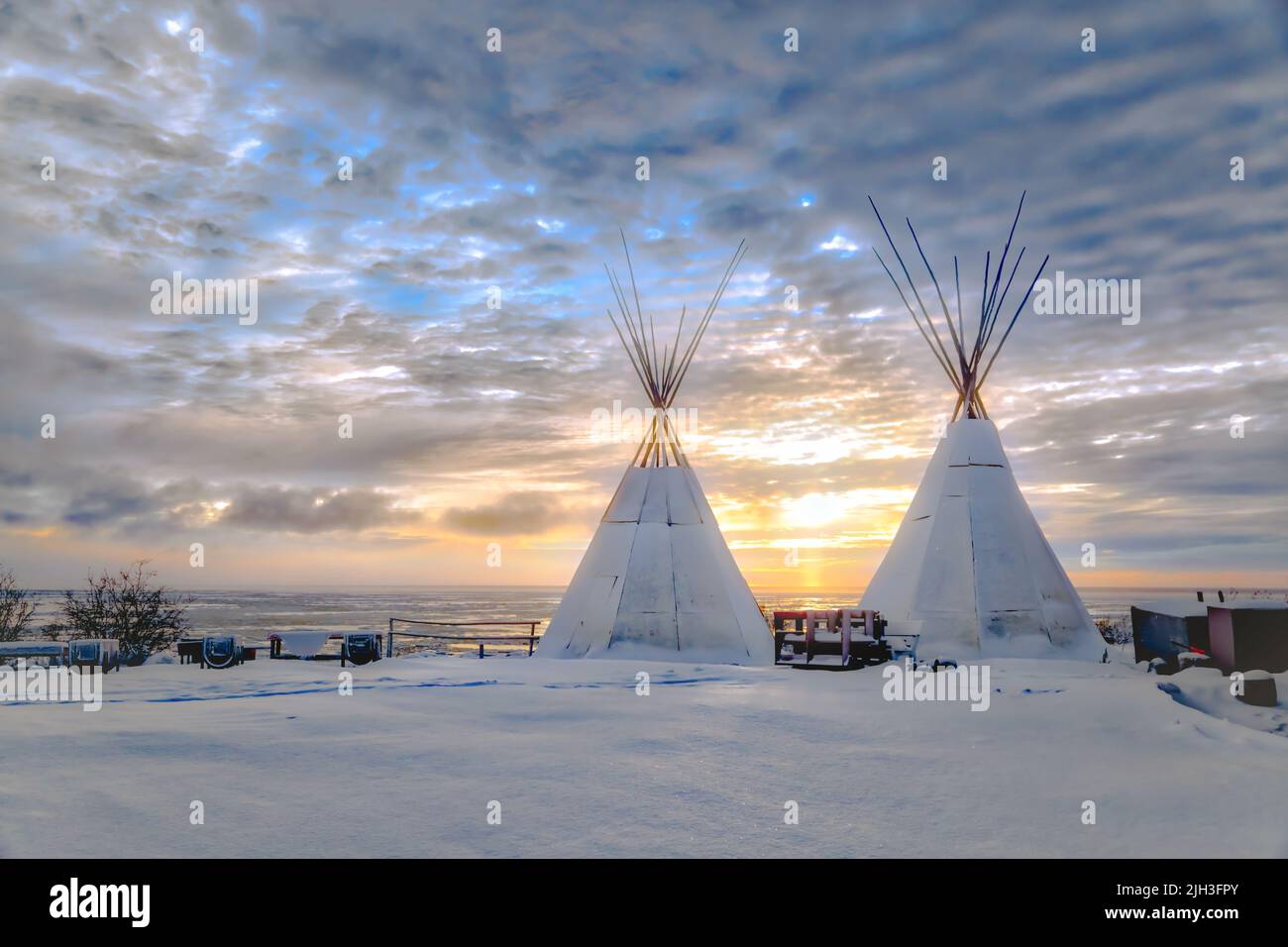 Traditional teepees along the shoreline of Great Bear Lake, with the ...