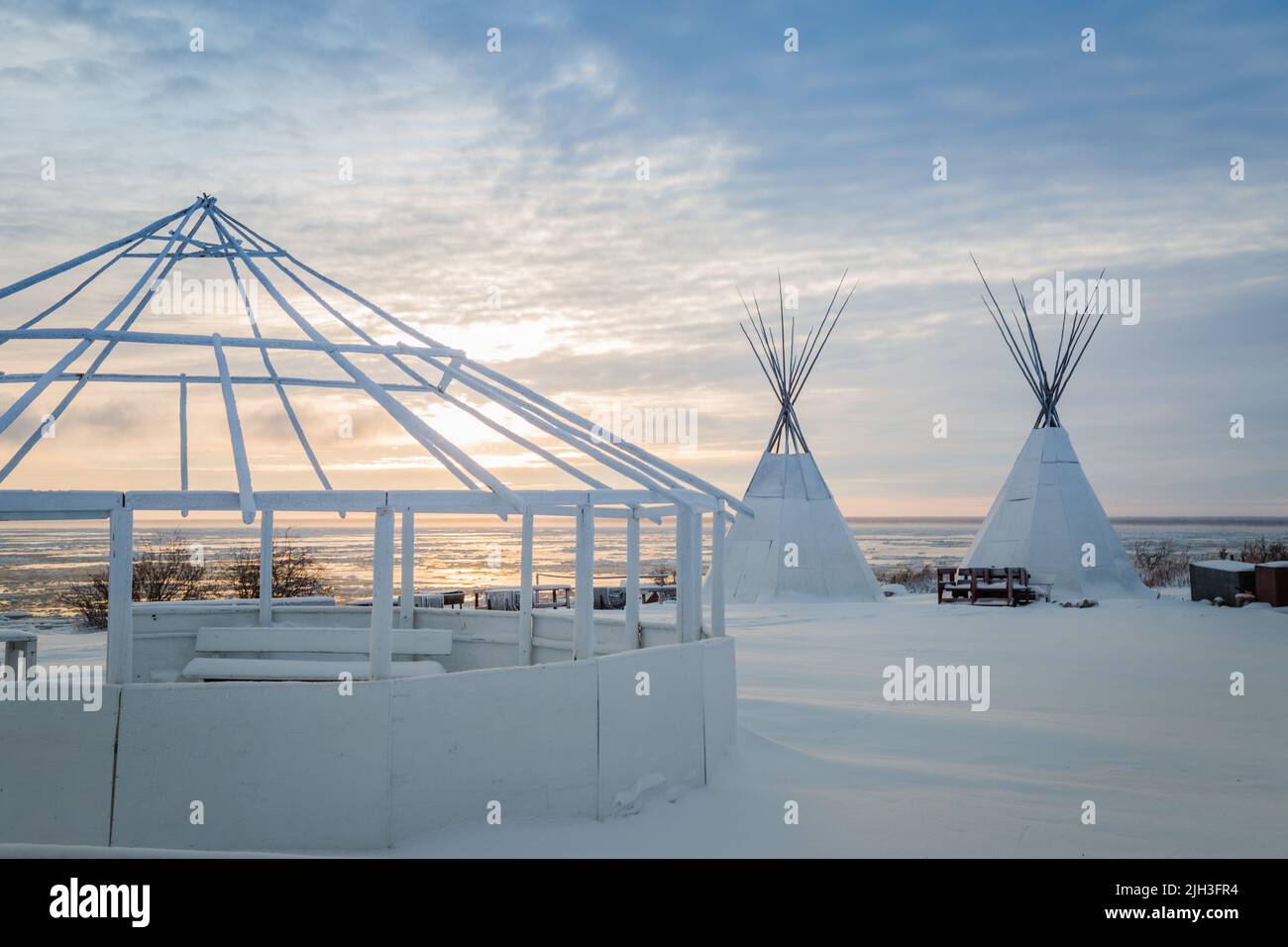 Arbor and traditional teepees in winter, in the northern Indigenous ...