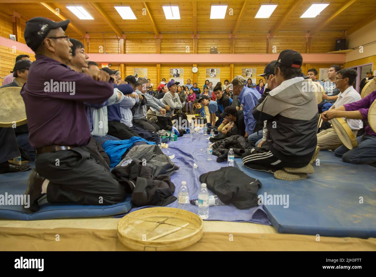 Indigenous men playing traditional handgames, in the northern ...