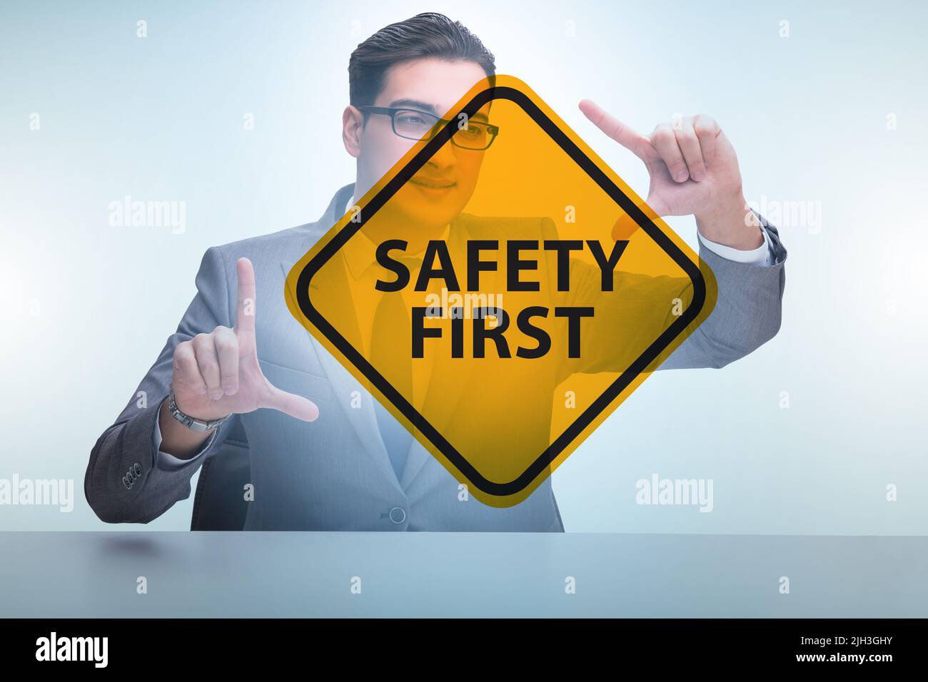 Safety first concept with the businessman Stock Photo - Alamy