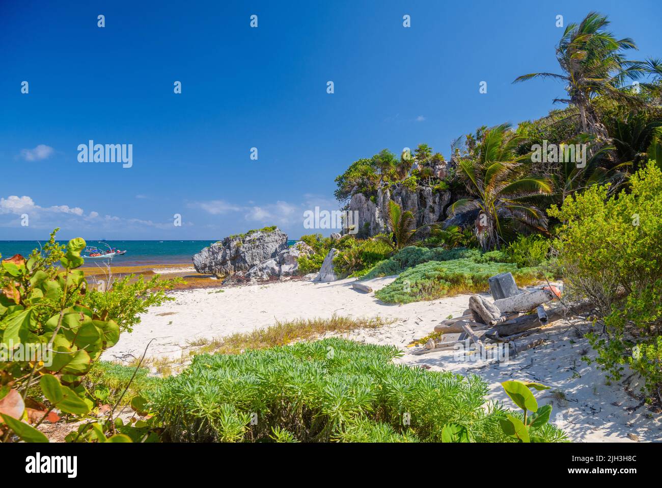 White sand beach with palms, temple of the descending god, Mayan Ruins ...
