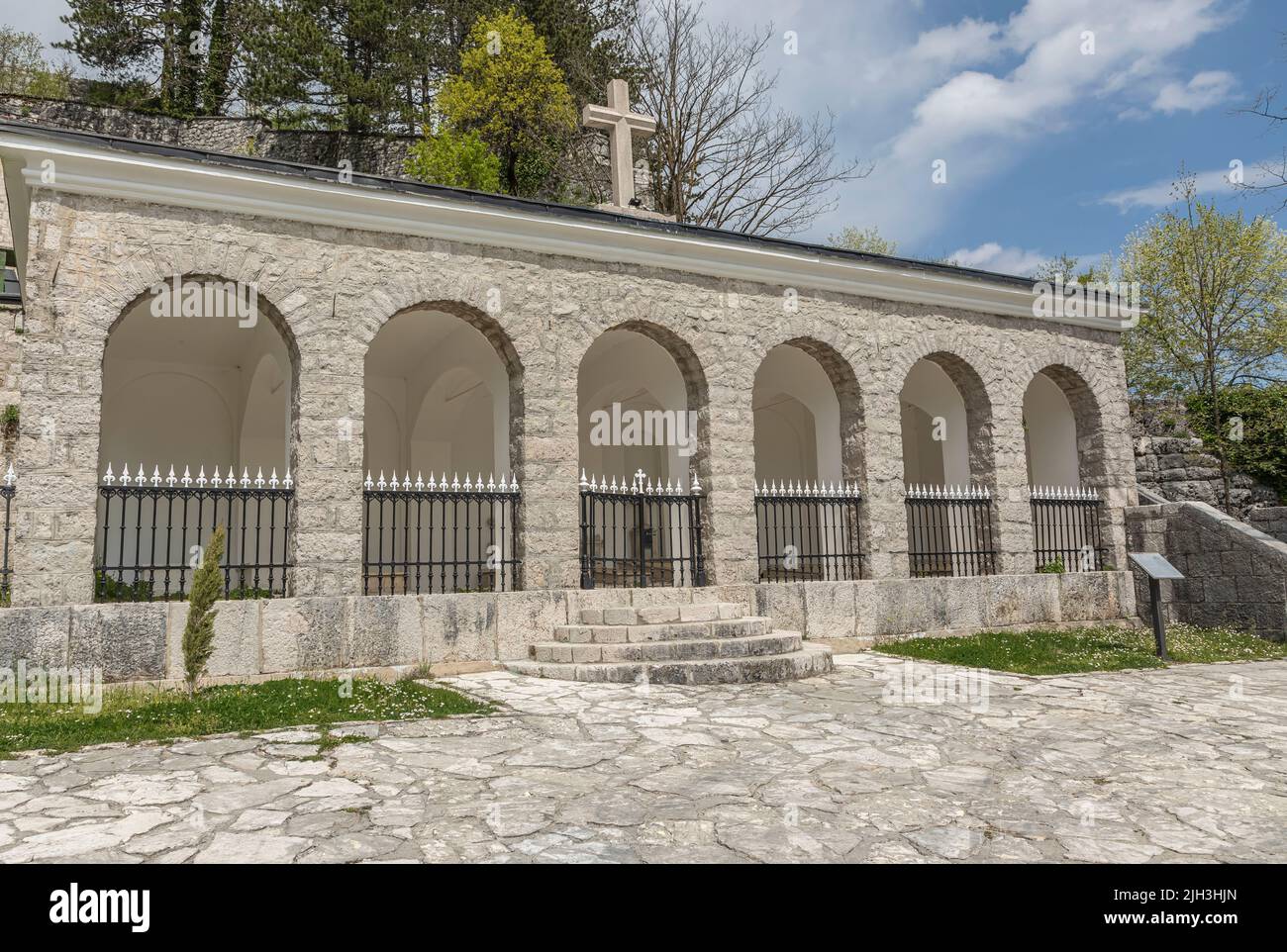 Archways of white stone in a religious building which is kept secure ...
