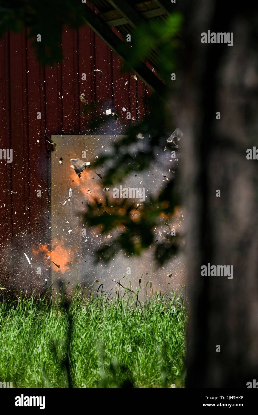 A wall breaching explosive detonates during a breaching training with U ...