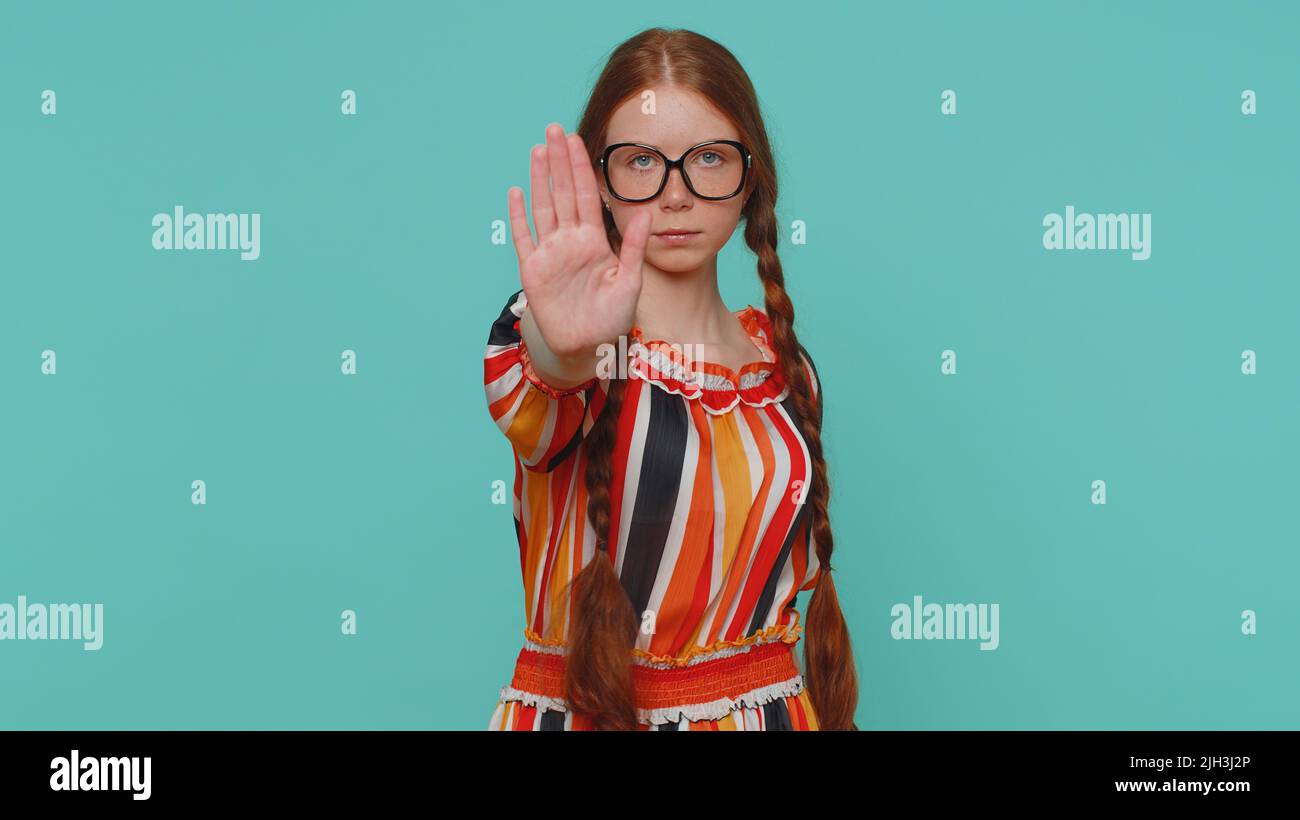 No stop. Serious girl say no, hold palm folded crossed hands in stop ...