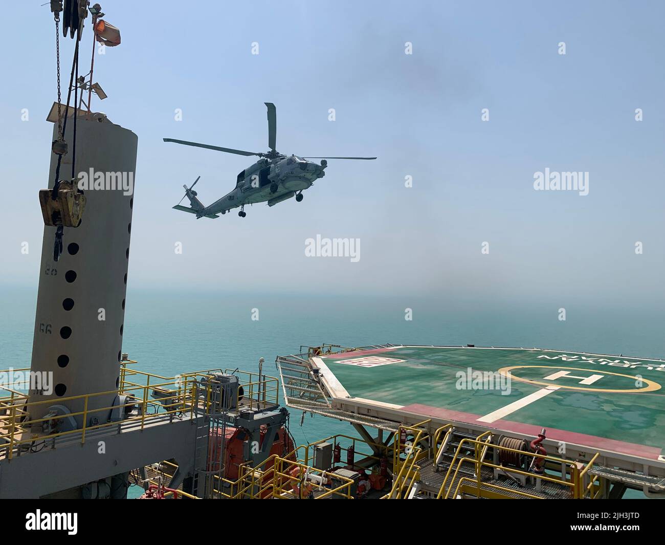 A U.S. Navy Helicopter attempts a landing the the Maritime Traffic ...