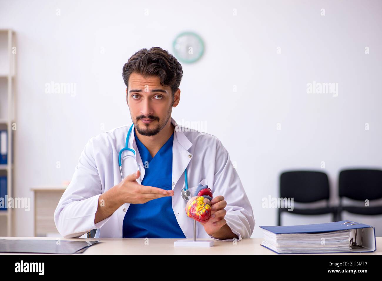 Young doctor cardiologist working at the hospital Stock Photo - Alamy