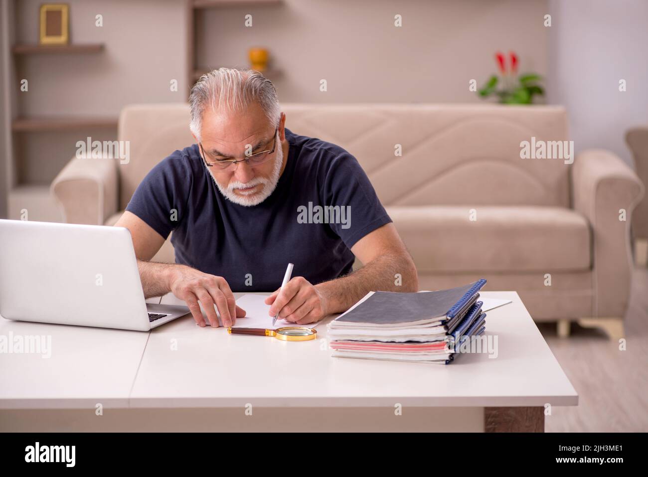 Old man employee working from home during pandemic Stock Photo - Alamy