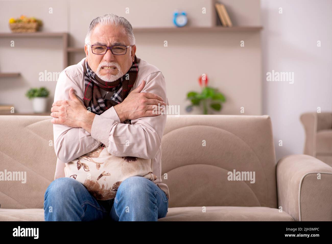 Sick old man coughing sitting hi-res stock photography and images - Alamy