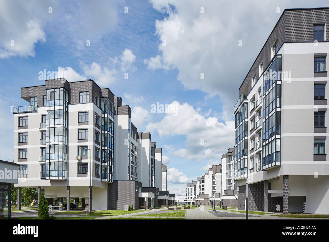 New modern block of flats in green area. residential apartment with ...