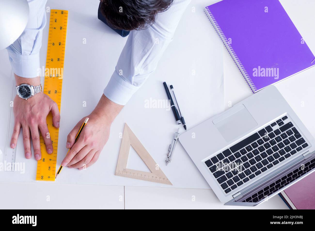 The engineer working on new project drawings Stock Photo - Alamy