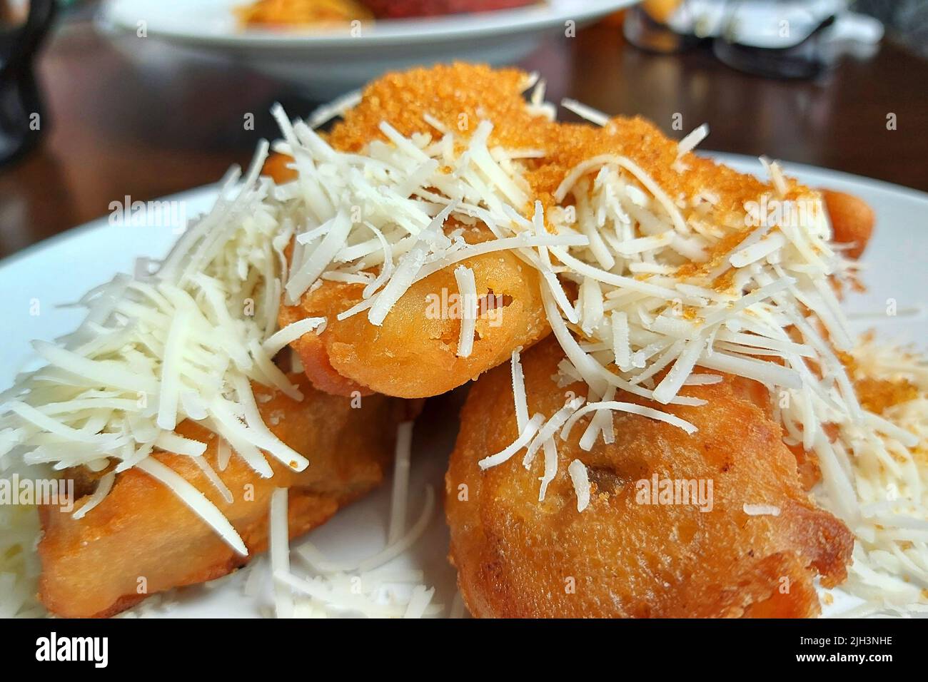 Cheese Fried Banana at Cafe Bandung, Indonesia Stock Photo - Alamy