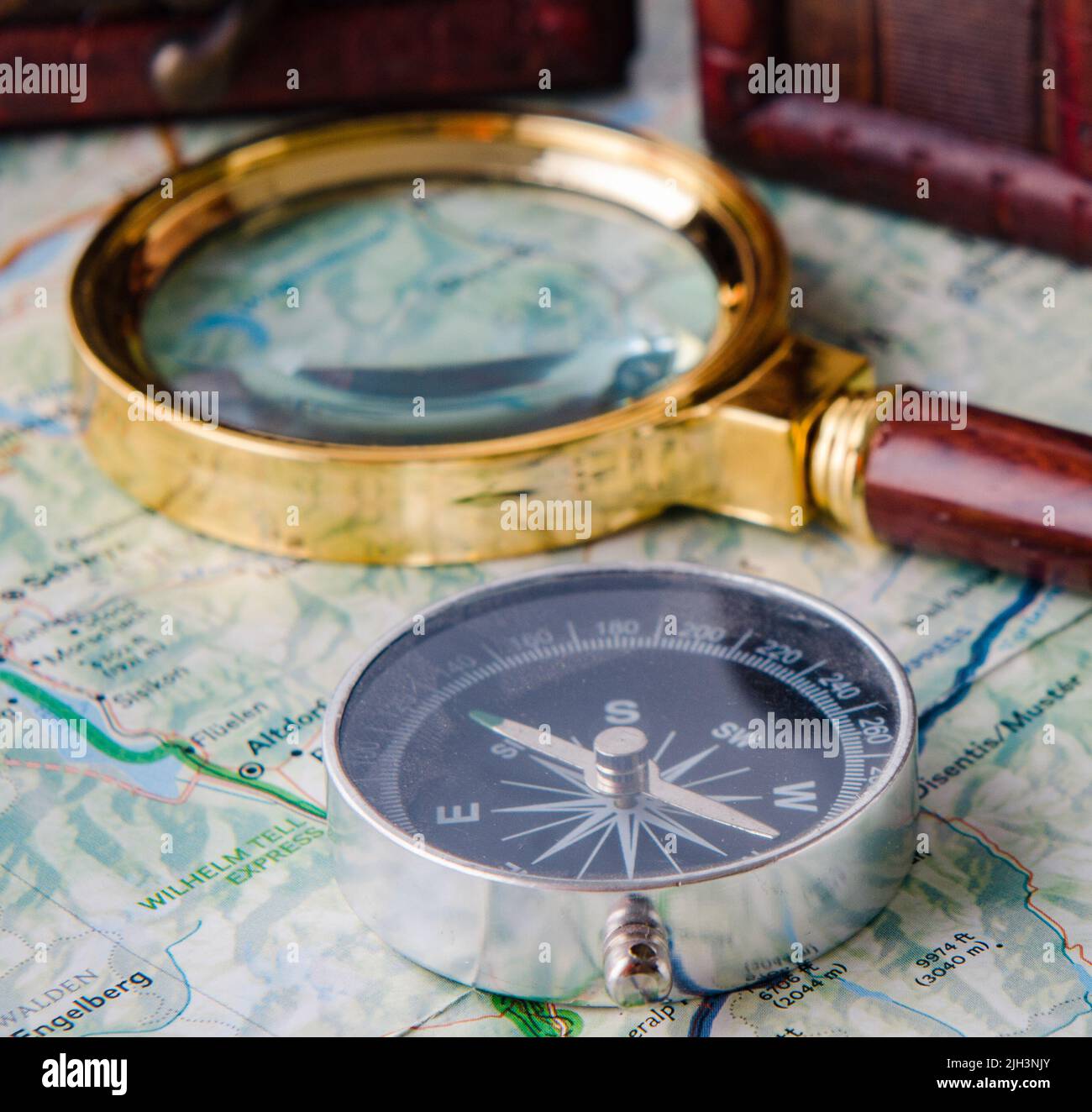 The travel concept with compass and map Stock Photo - Alamy