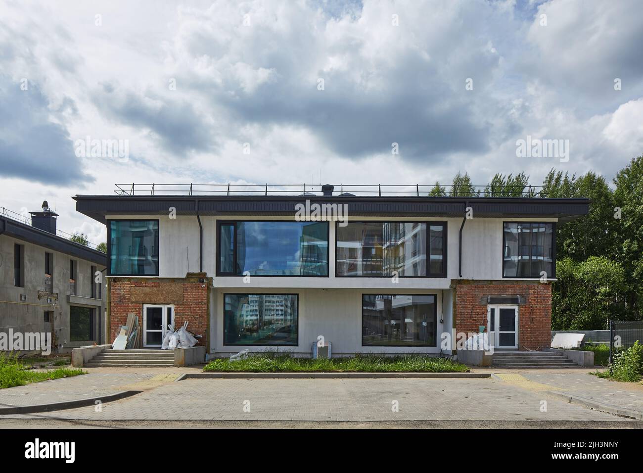 New modern house under construction in green area. residential ...