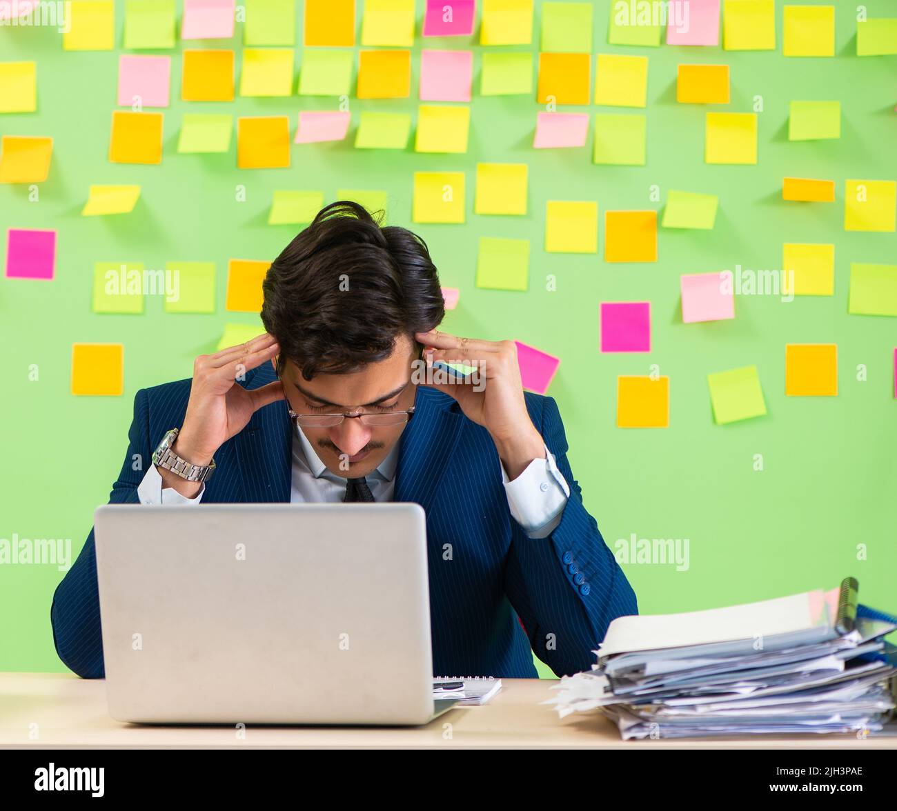 The businessman having trouble with his priorities Stock Photo - Alamy
