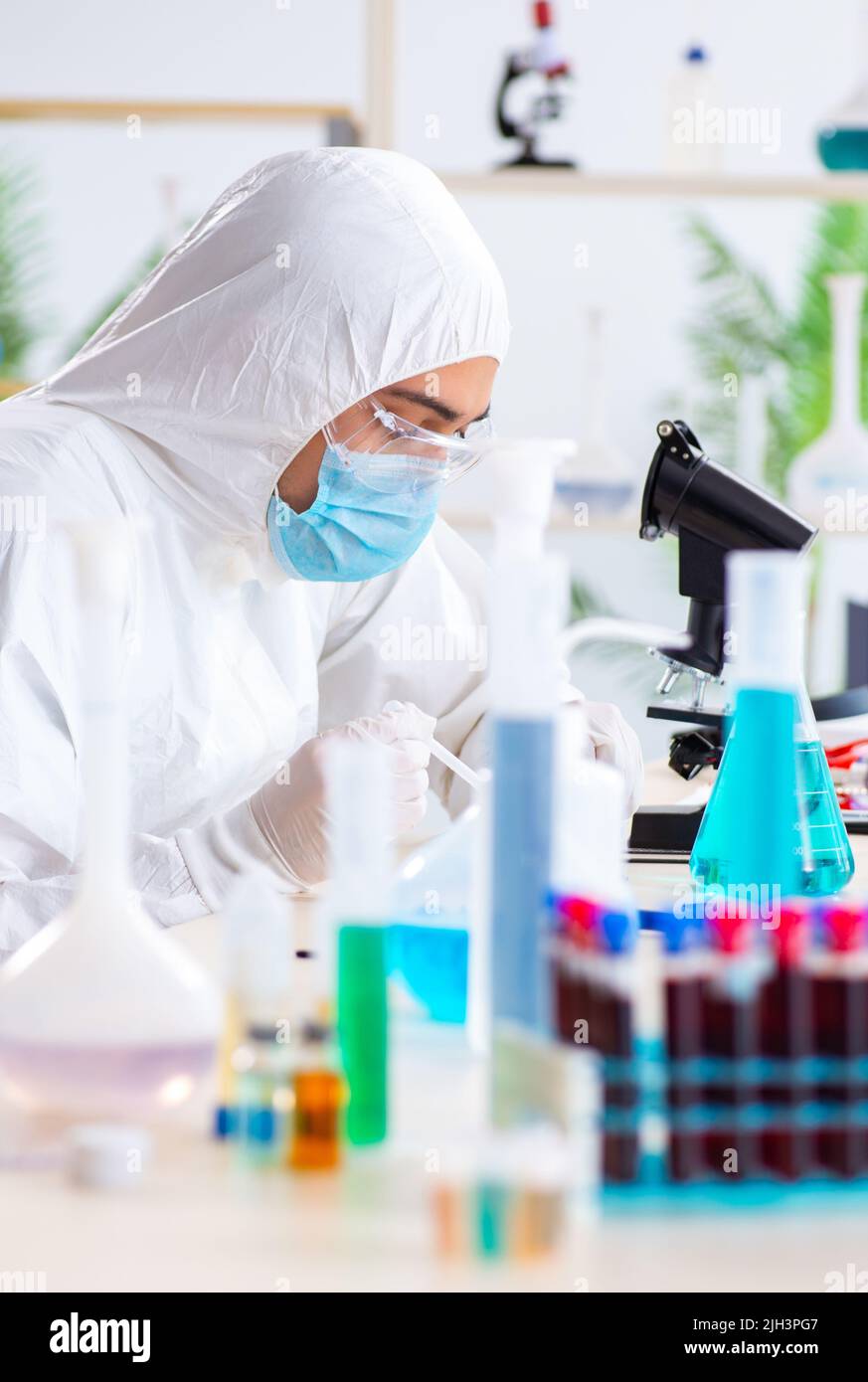 Scientist pouring chemicals in laboratory hi-res stock photography and ...