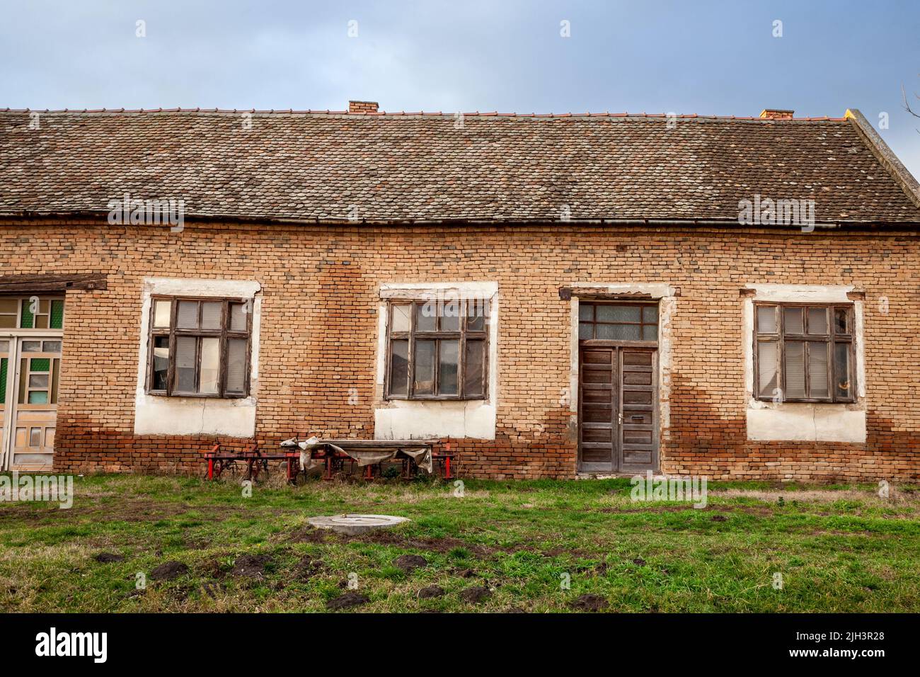 Picture of an abandoned farm in Vojvodina, in Serbia, with the facade ...