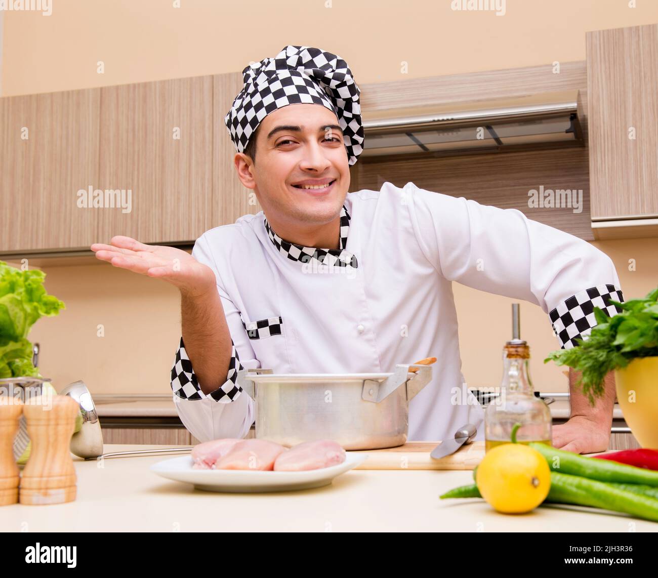 The young chef working in the kitchen Stock Photo - Alamy