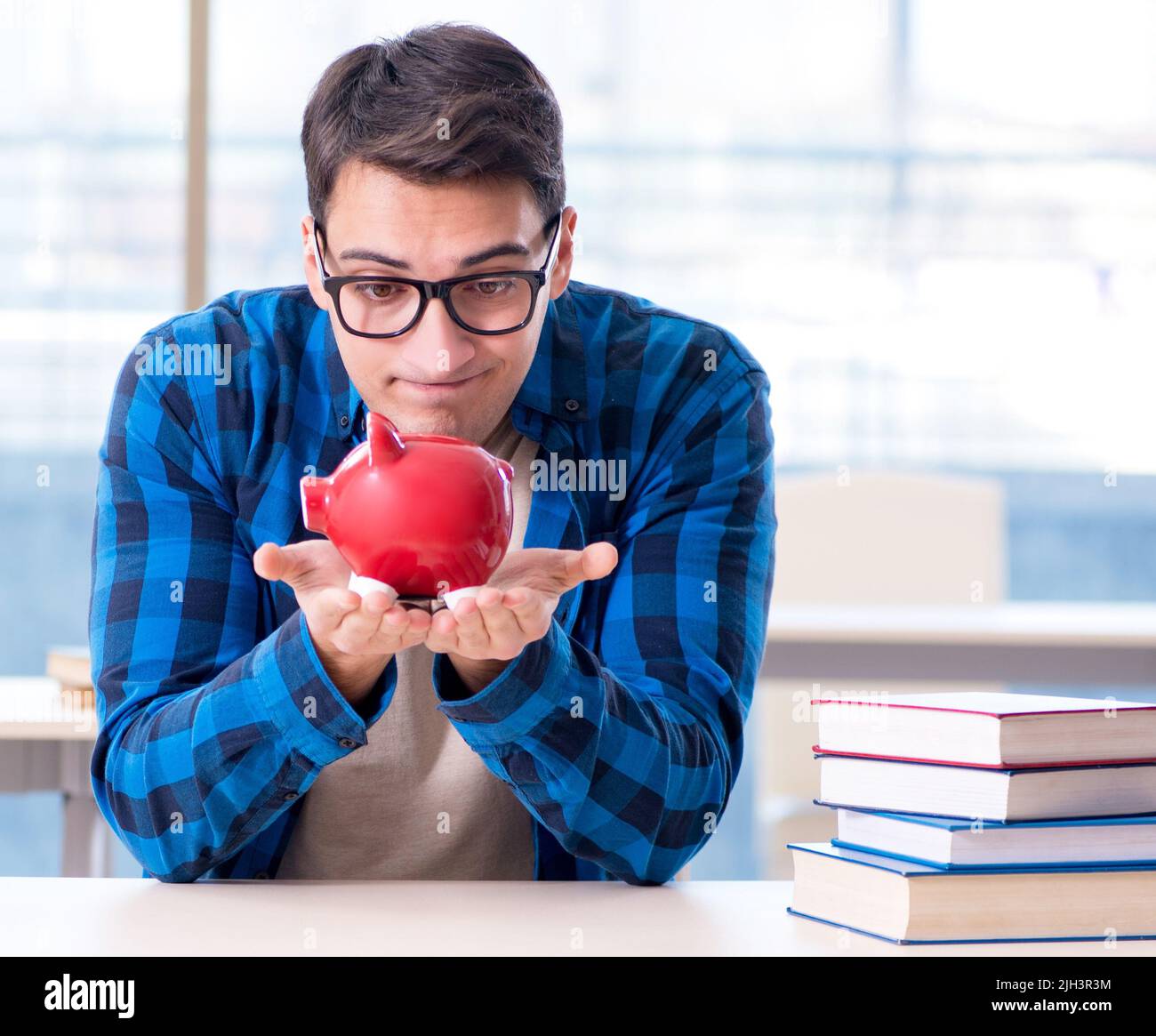 Concept of expensive textbooks and cost of education Stock Photo - Alamy