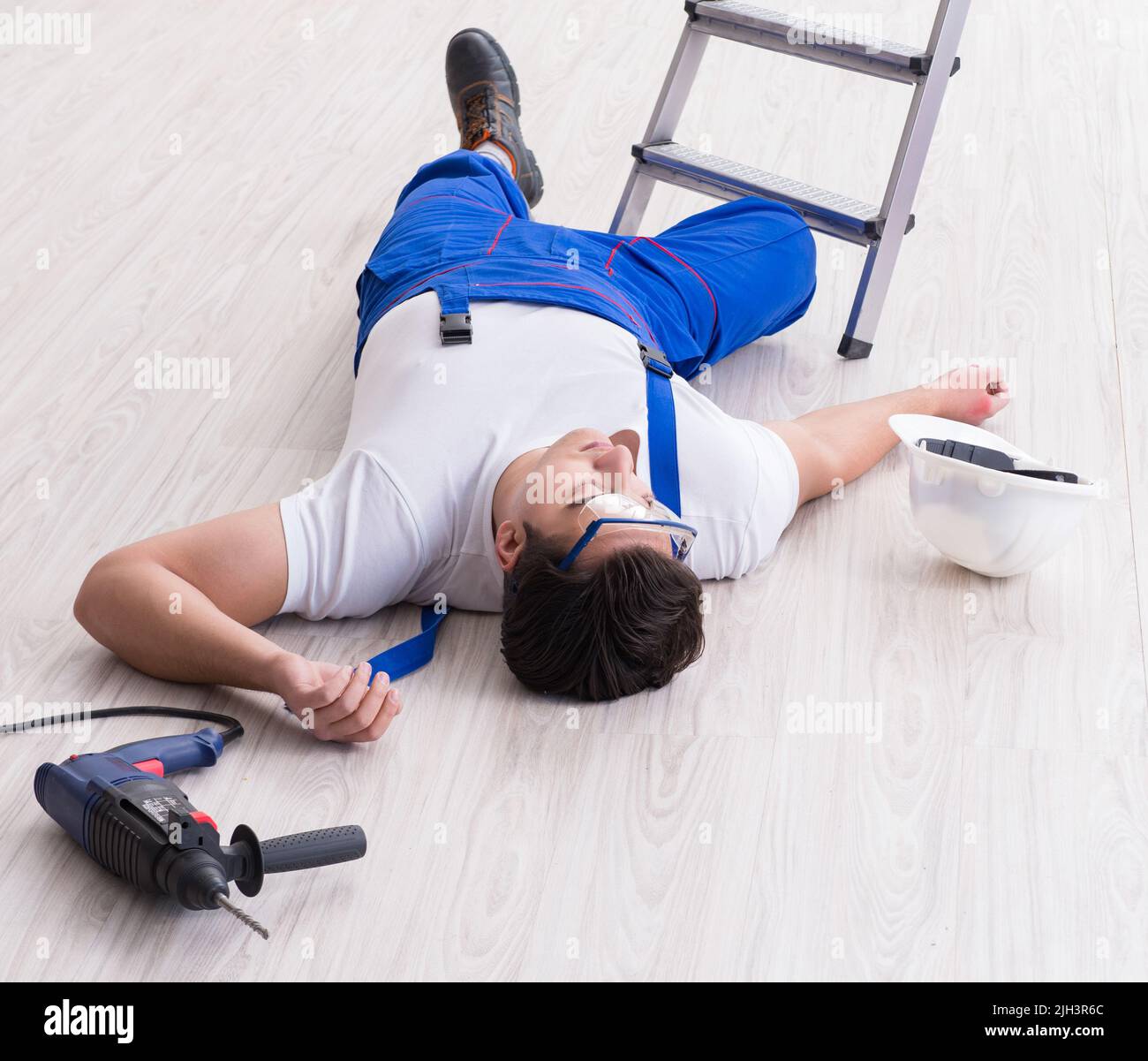 The worker after falling from height - unsafe behavior Stock Photo - Alamy