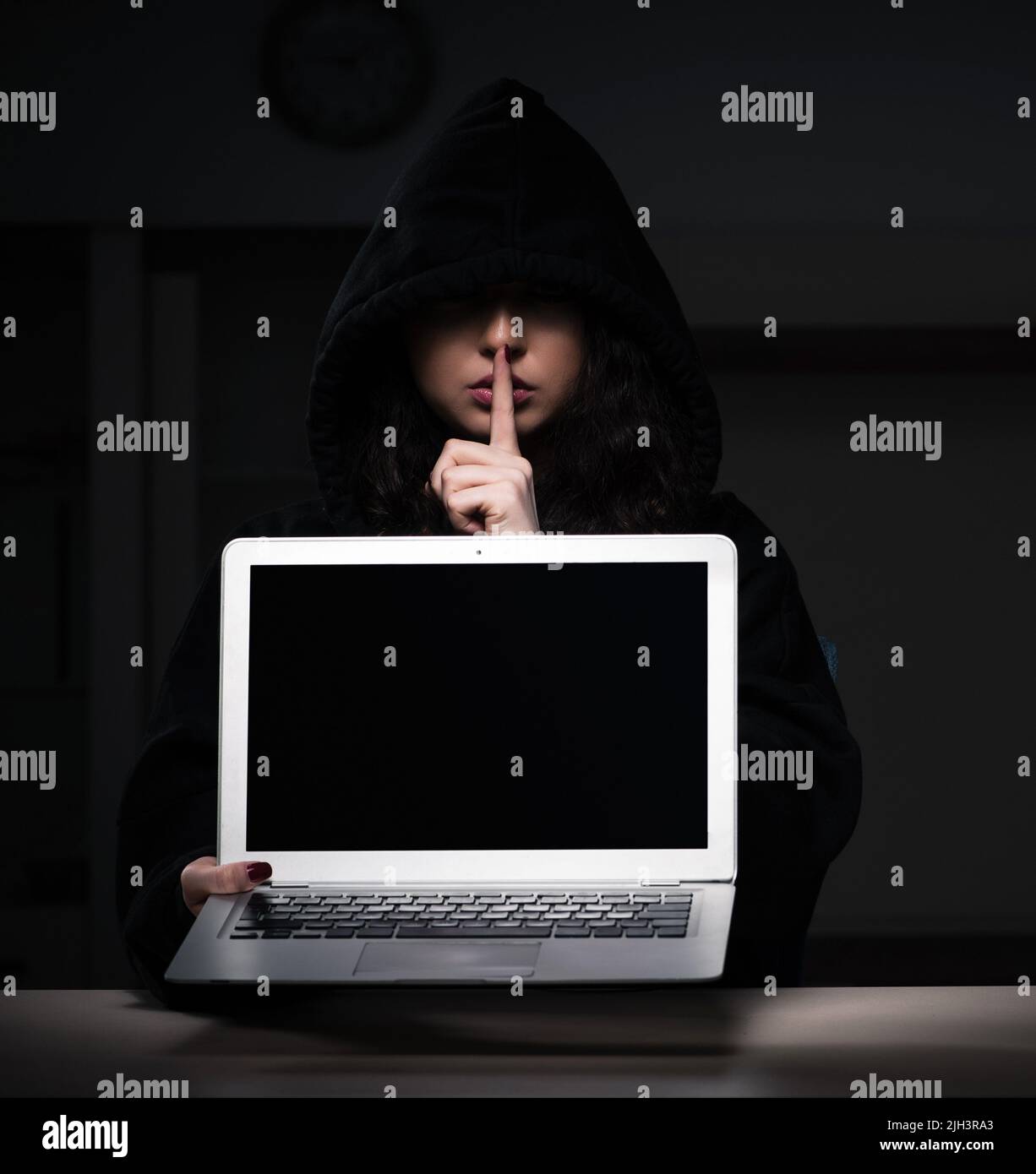 The female hacker hacking security firewall late in office Stock Photo ...