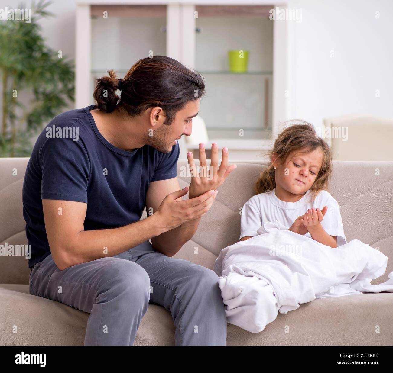 The father taking care of his ill daughter Stock Photo - Alamy
