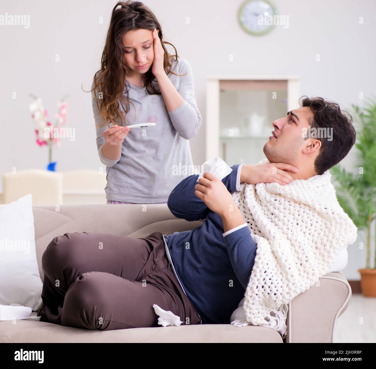 The wife caring for sick husband at home Stock Photo - Alamy