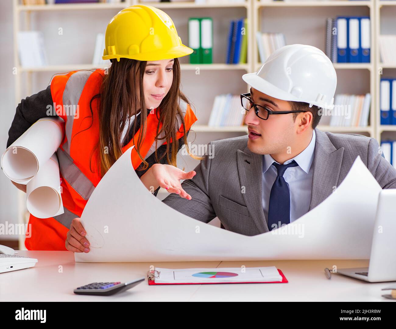 The construction foreman supervisor reviewing drawings Stock Photo - Alamy