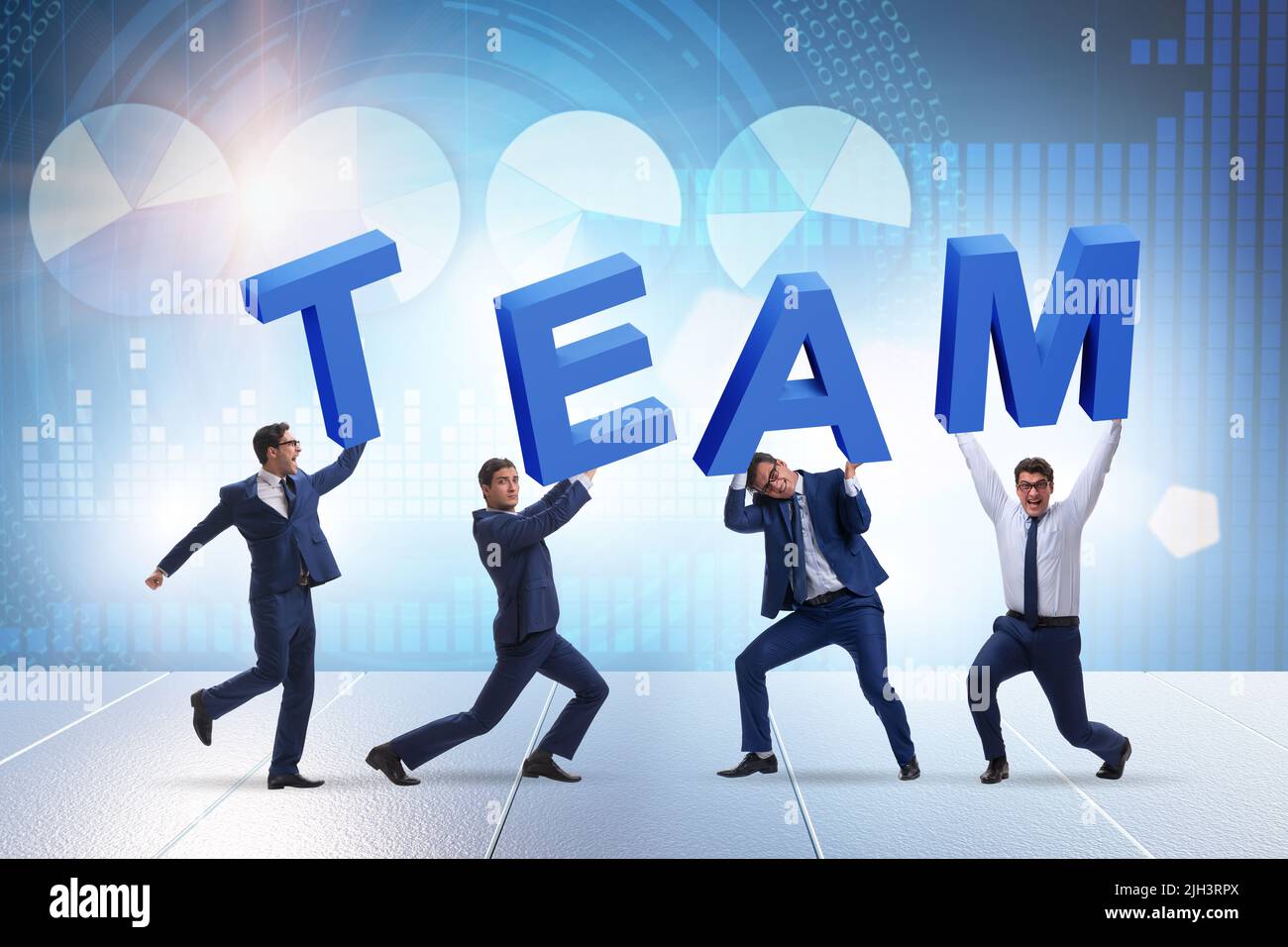 Teamwork concept with the people carrying team letters Stock Photo - Alamy