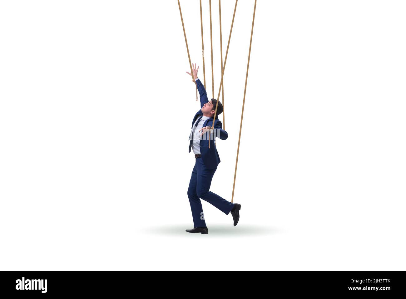 Businessman puppet being manipulated by the ropes Stock Photo - Alamy