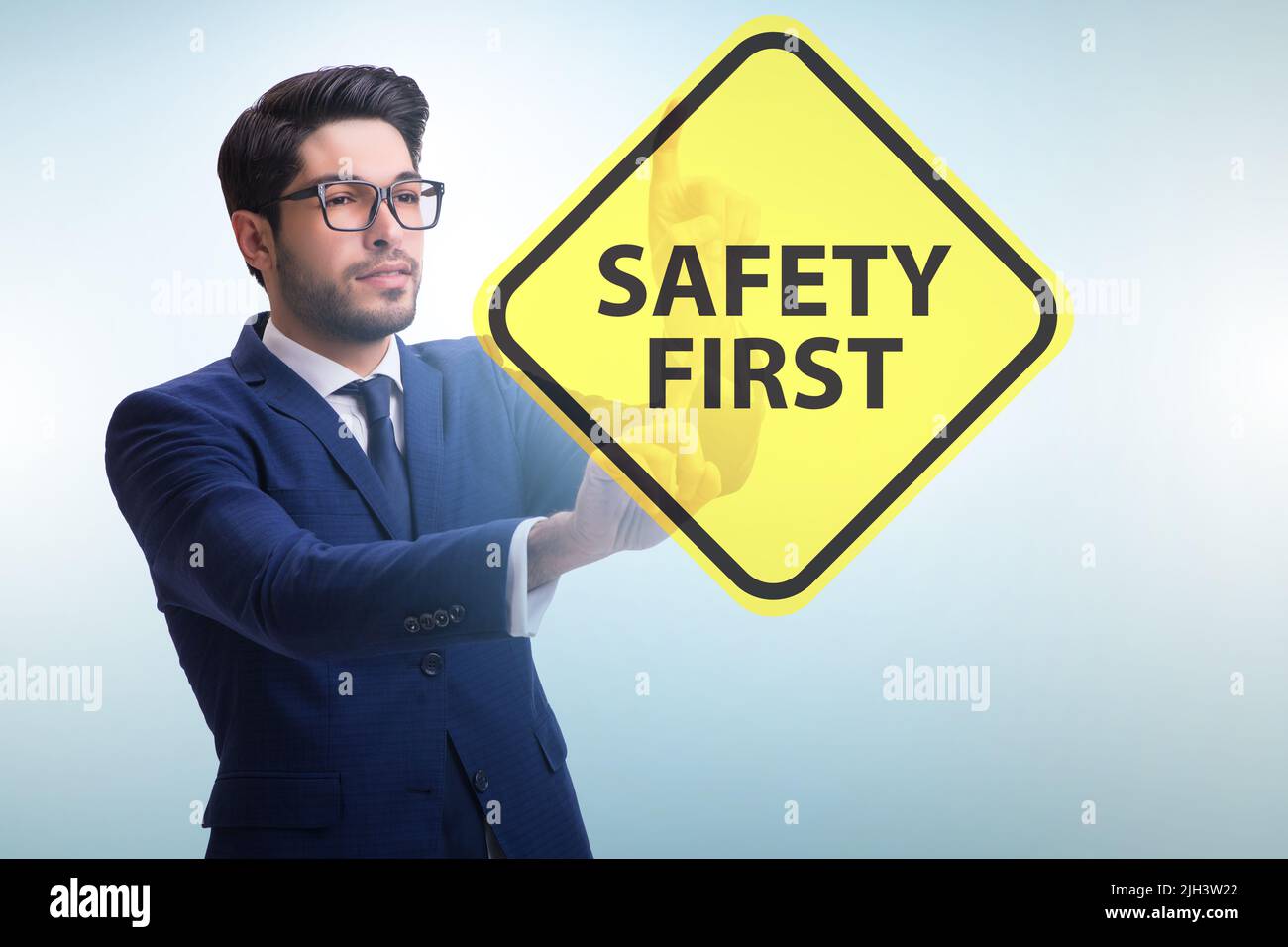 Safety first concept with the businessman Stock Photo - Alamy