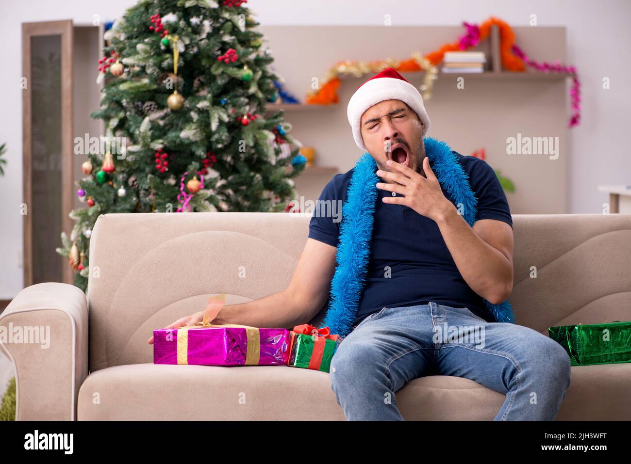Young man celebrating New year at home alone Stock Photo - Alamy