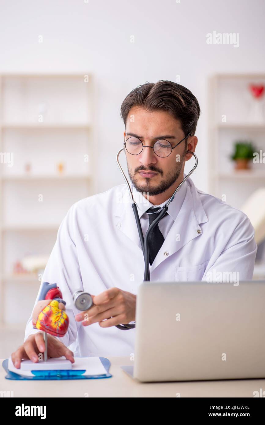 Young doctor cardiologist working at the hospital Stock Photo - Alamy