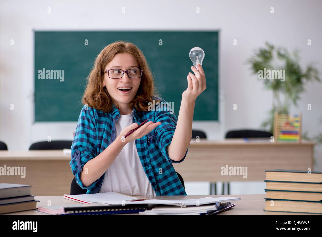 Female student in happy idea concept Stock Photo - Alamy