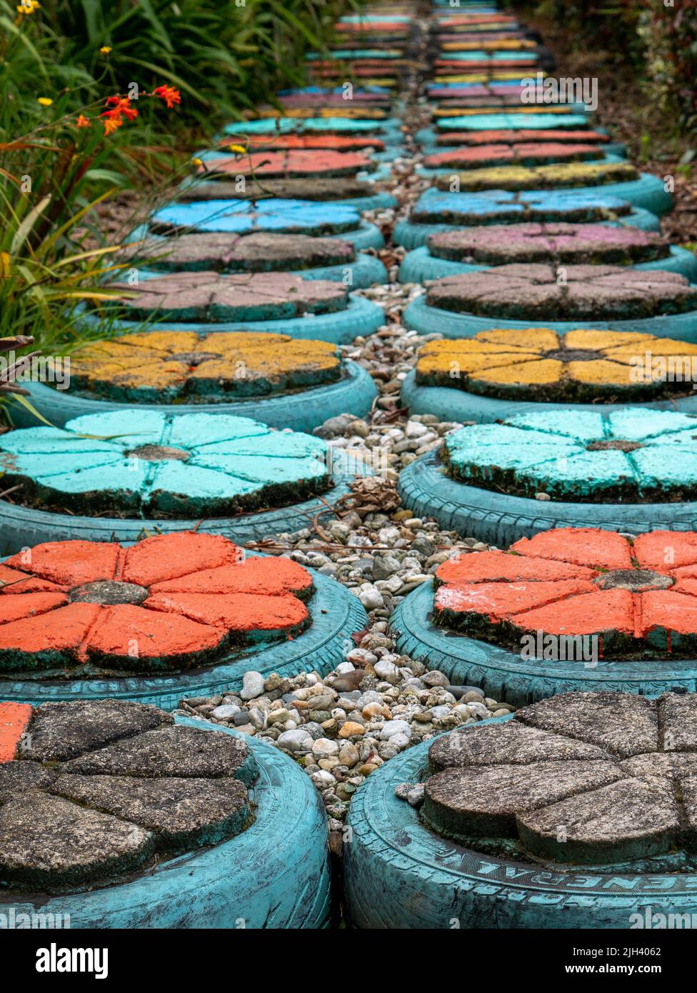 Road of Cement Flowers of Different Colors Made with Tires Stock Photo ...