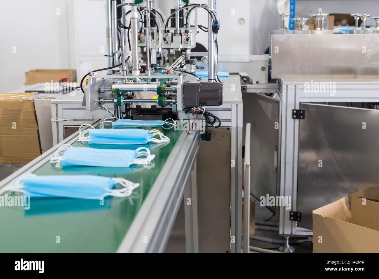 Production of disposable medical clothing for protection. Medical mask ...